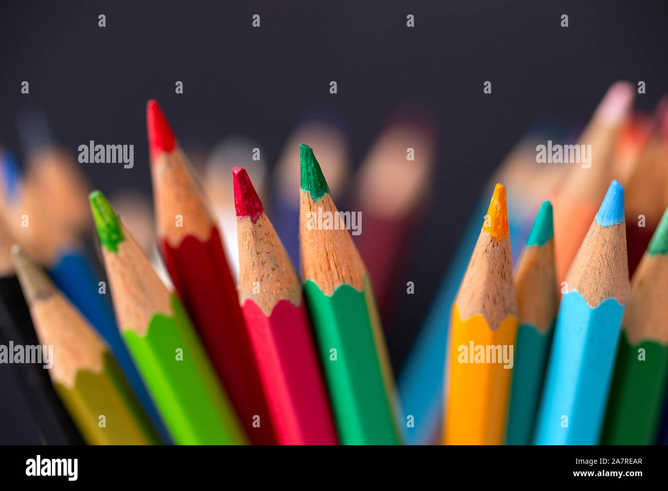 Stationary: Bunch of random colored pencils, close up macro. Black ...
