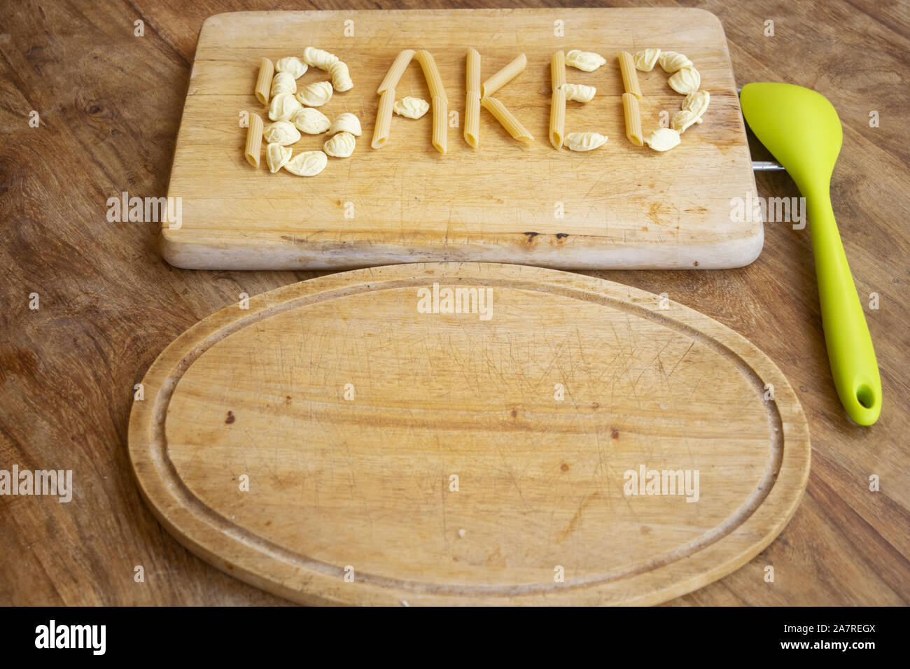 baked word written with pieces of pasta Stock Photo - Alamy