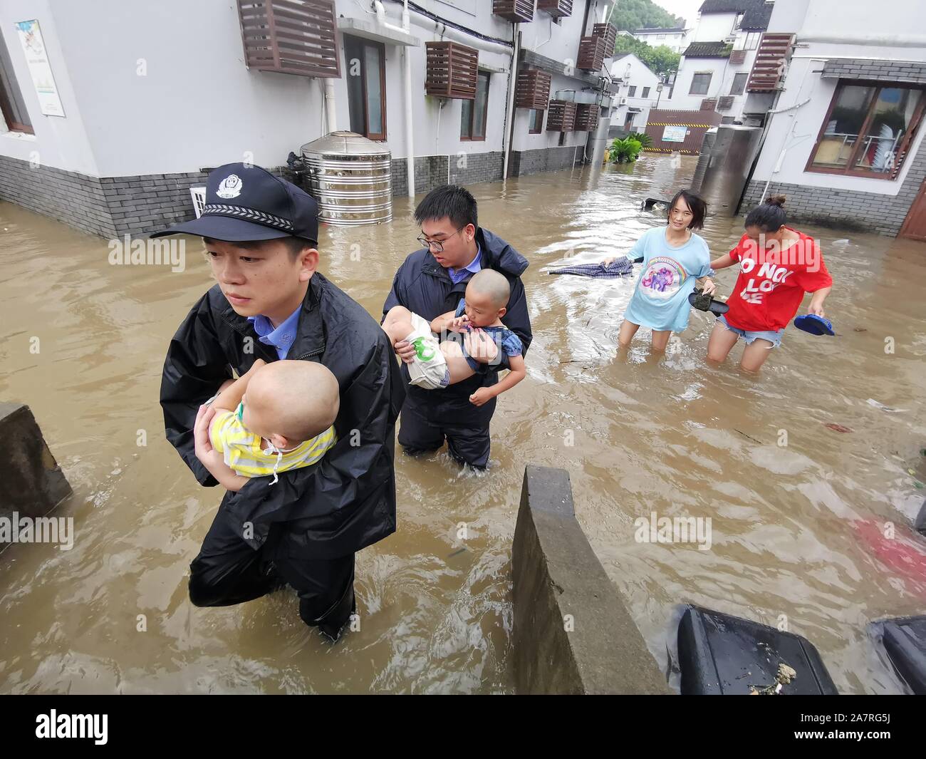 Chinese rescuers evacuate babies in floodwater after heavy rainstorm ...