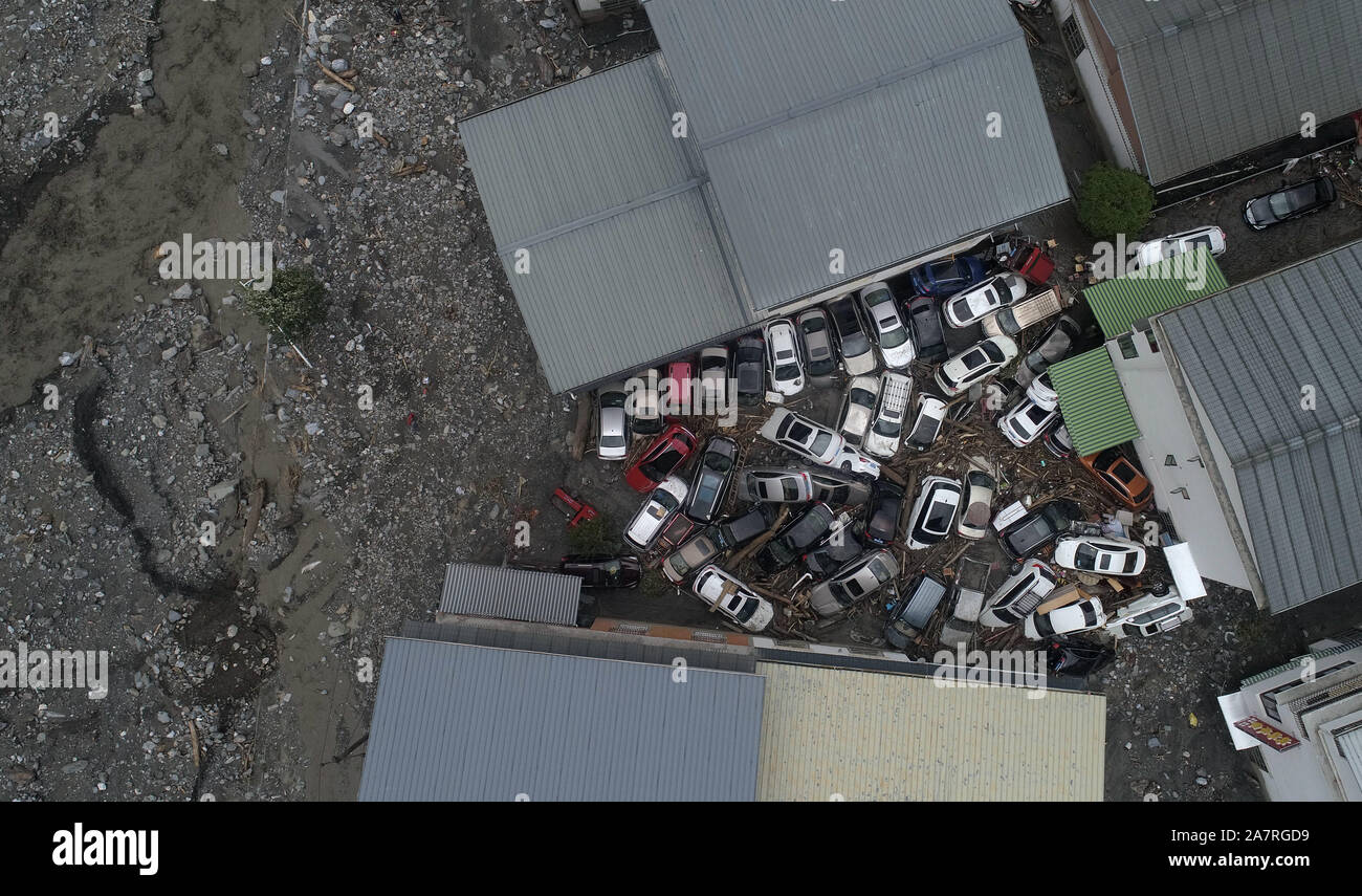 Residential buildings are covered with mud and stones after being hit ...