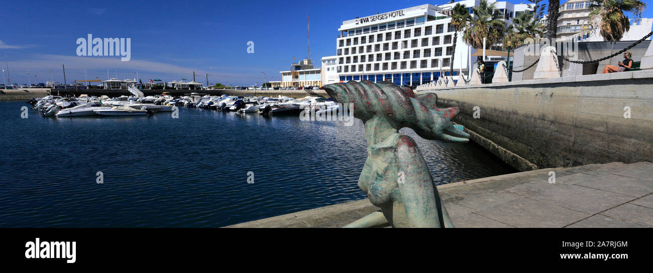 Brass sculpture of a mermaid in Faro city's marina, capital of the ...