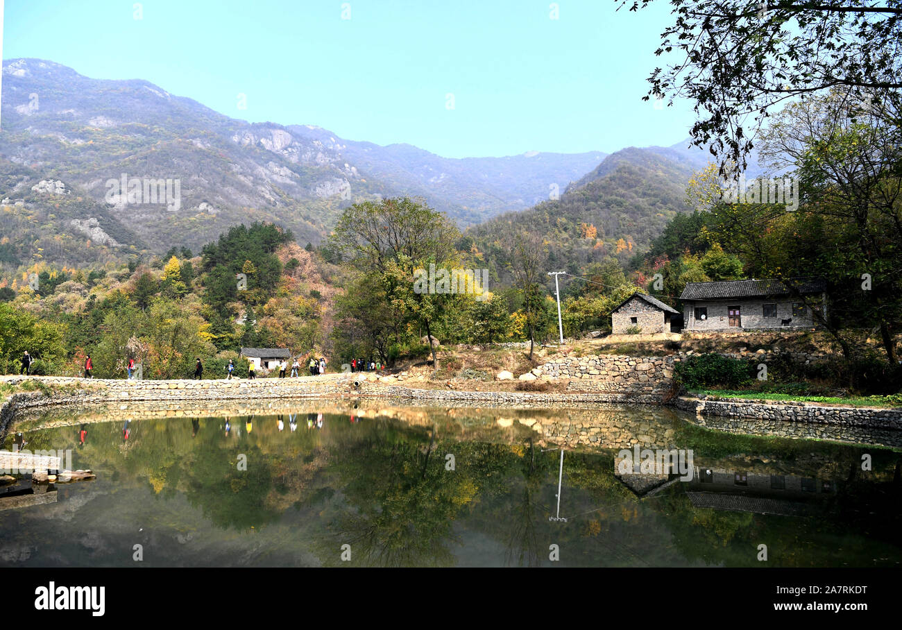 Xinyang, China's Henan Province. 3rd Nov, 2019. Tourists enjoy the ...