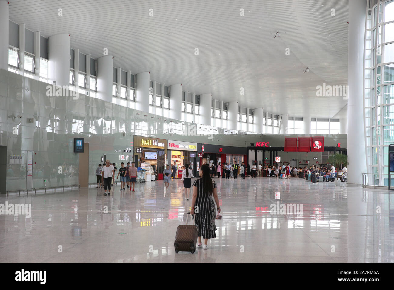 Passengers departure and arrive at the new terminal of Nantong Xingdong ...