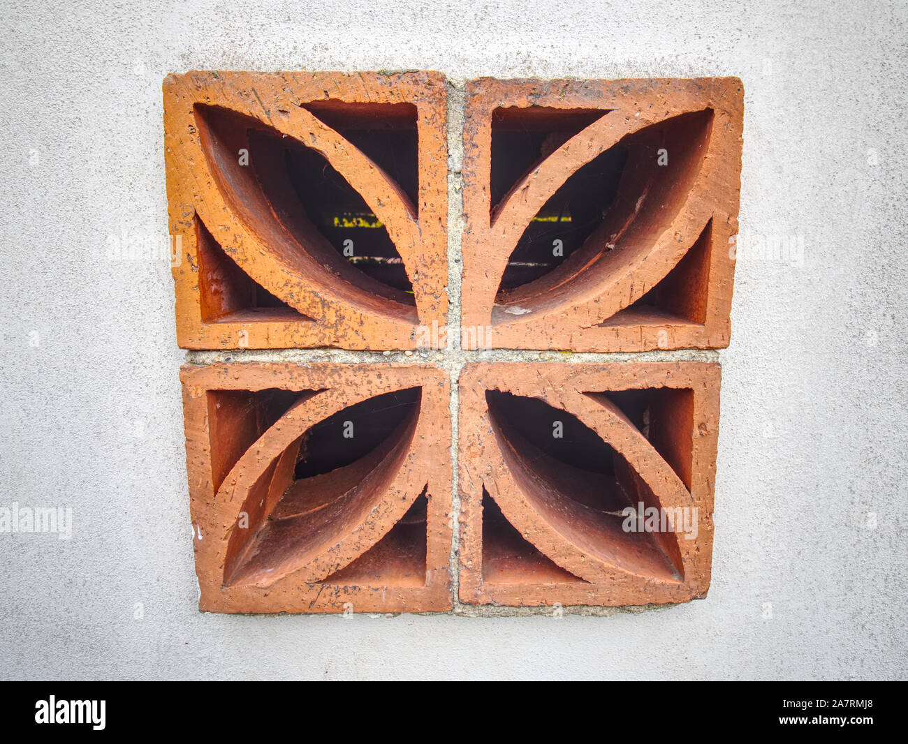 Red bricks with holes used into wall for air circulation. Good idea in ...