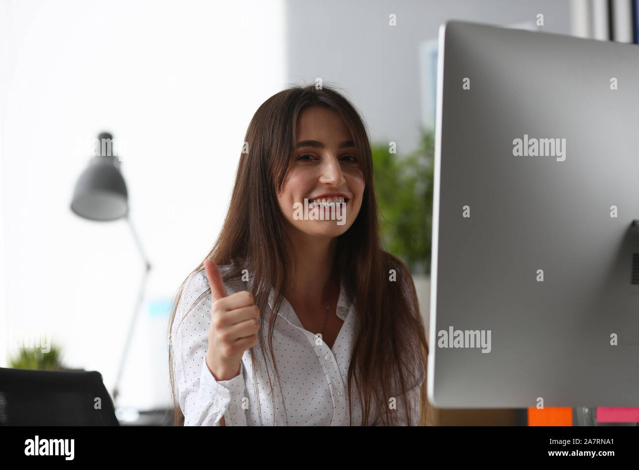 Pretty woman showing approving mark Stock Photo - Alamy