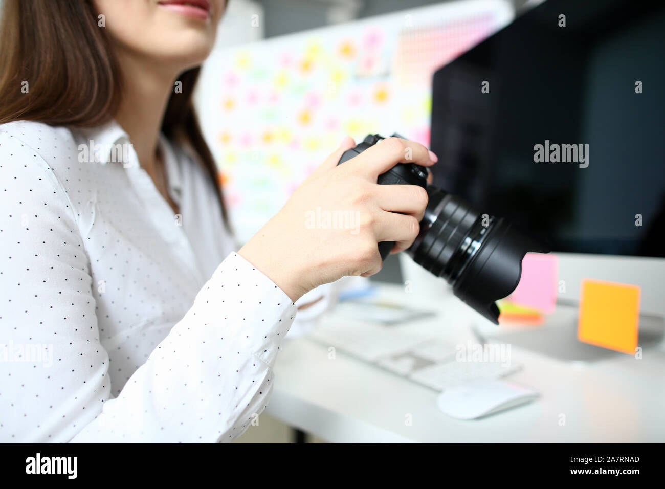 Pretty woman at workplace Stock Photo - Alamy