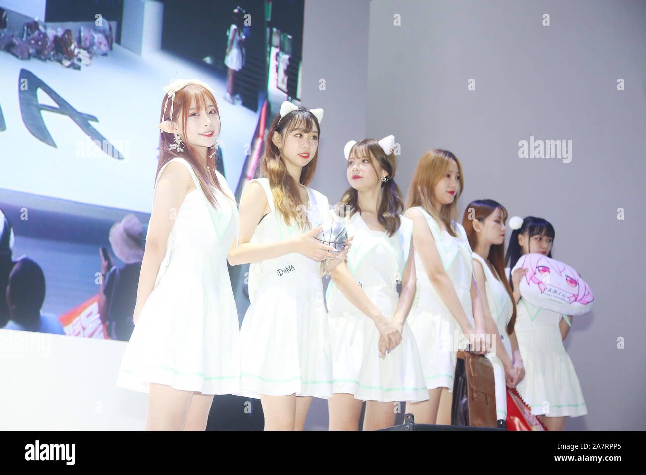 Chinese showgirls pose during the 17th China Digital Entertainment Expo ...