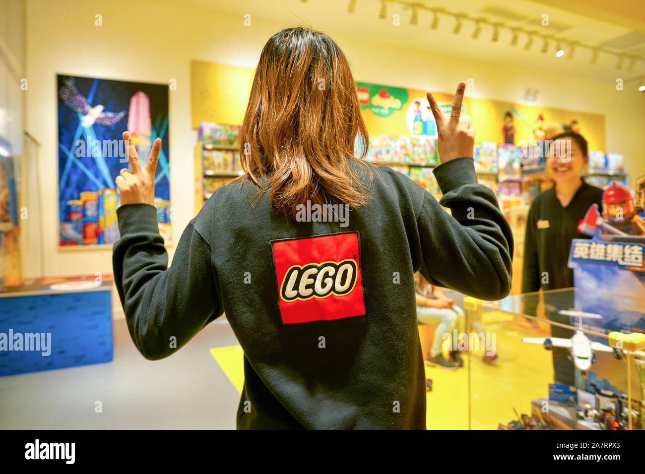 SHENZHEN, CHINA - APRIL 19, 2019: Lego sign on staff uniform at Lego ...