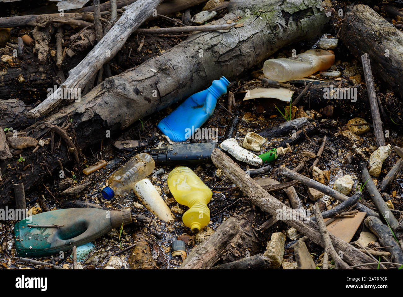 Plastic and styrofoam pollution from ocean on beach. Dirty spilled ...