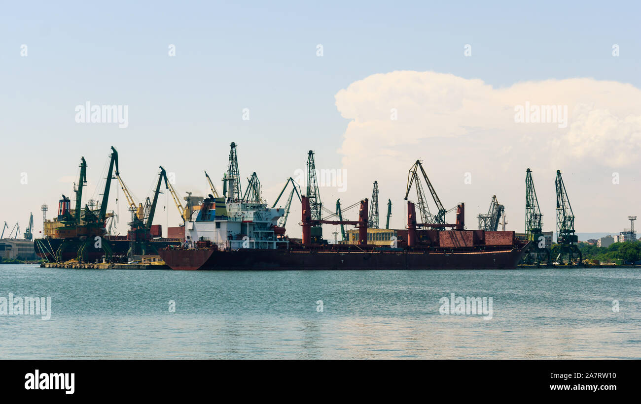 view of the seaport, docks, unloading of ships Stock Photo - Alamy