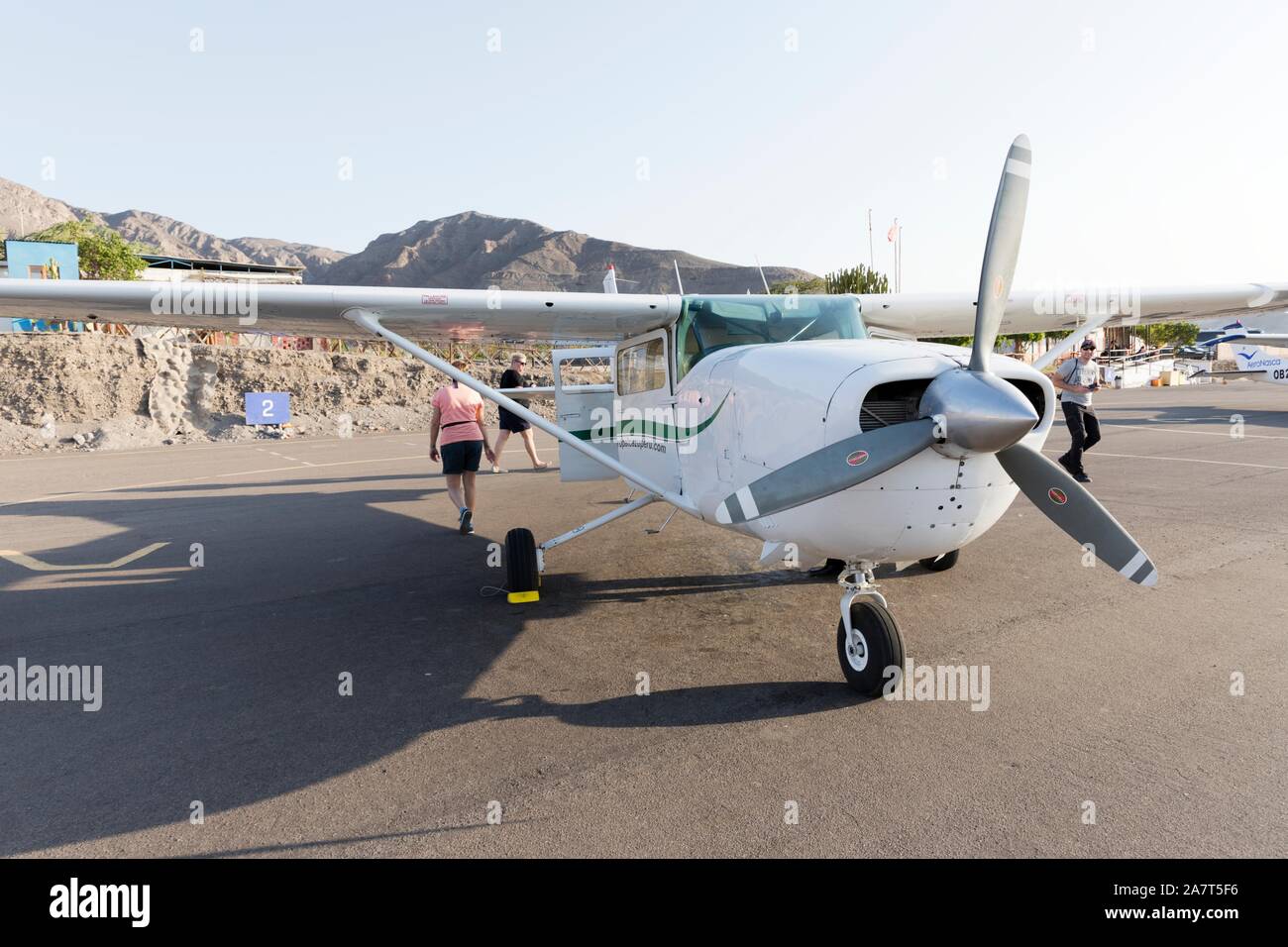 PERU, NAZCA- circa OCTOBER, 2019: small airplane takes 6 tourists on ...