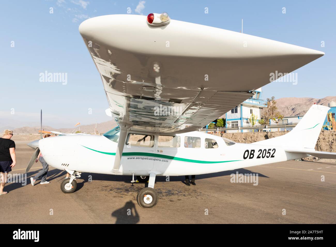PERU, NAZCA- circa OCTOBER, 2019: small airplane takes 6 tourists on ...