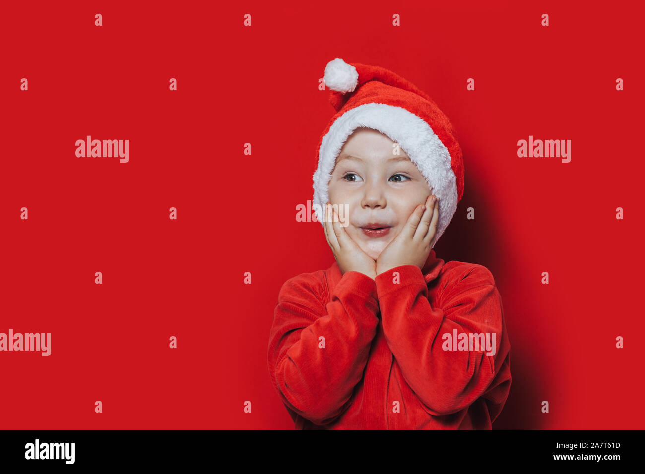 Small boy in Santa suit Stock Photo - Alamy