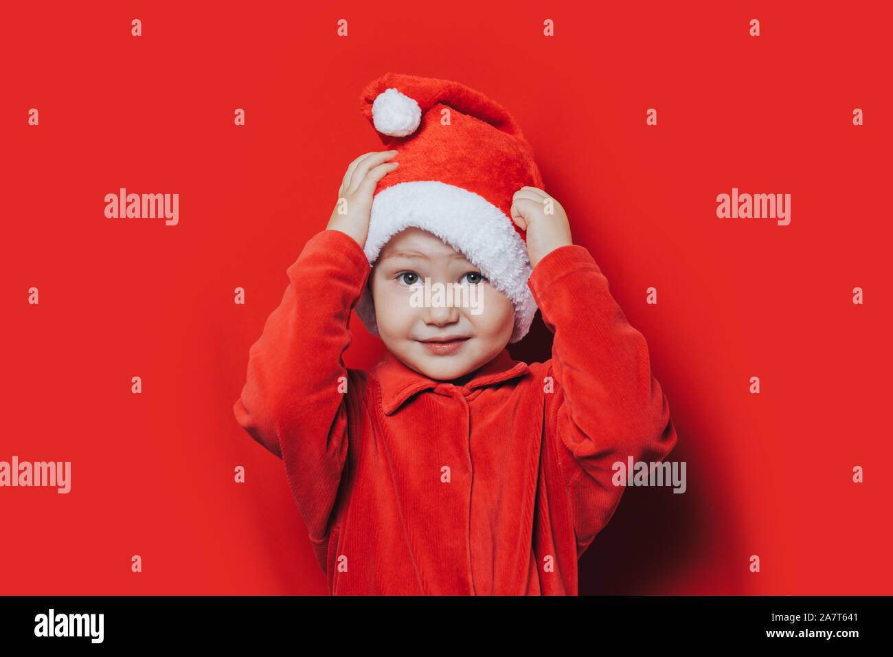Small boy in Santa suit Stock Photo - Alamy