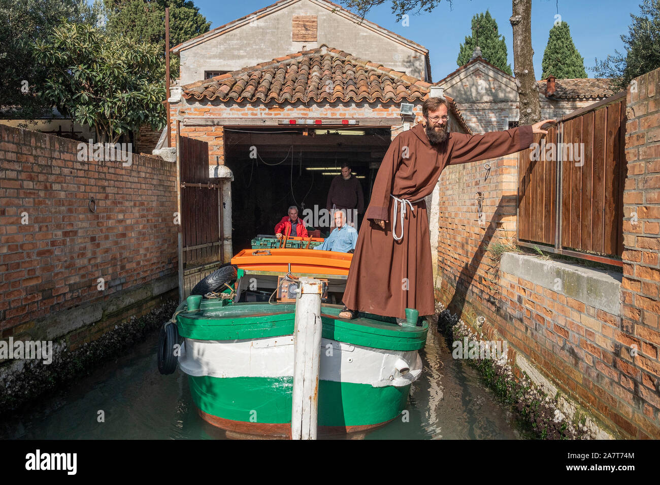 VENICE, ITALY - OCTOBER 23: The Cappuccini Friars collects olives in ...
