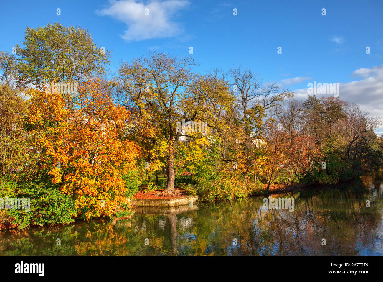 Amazing autumn scenery with calm lake and colorful trees Stock Photo ...