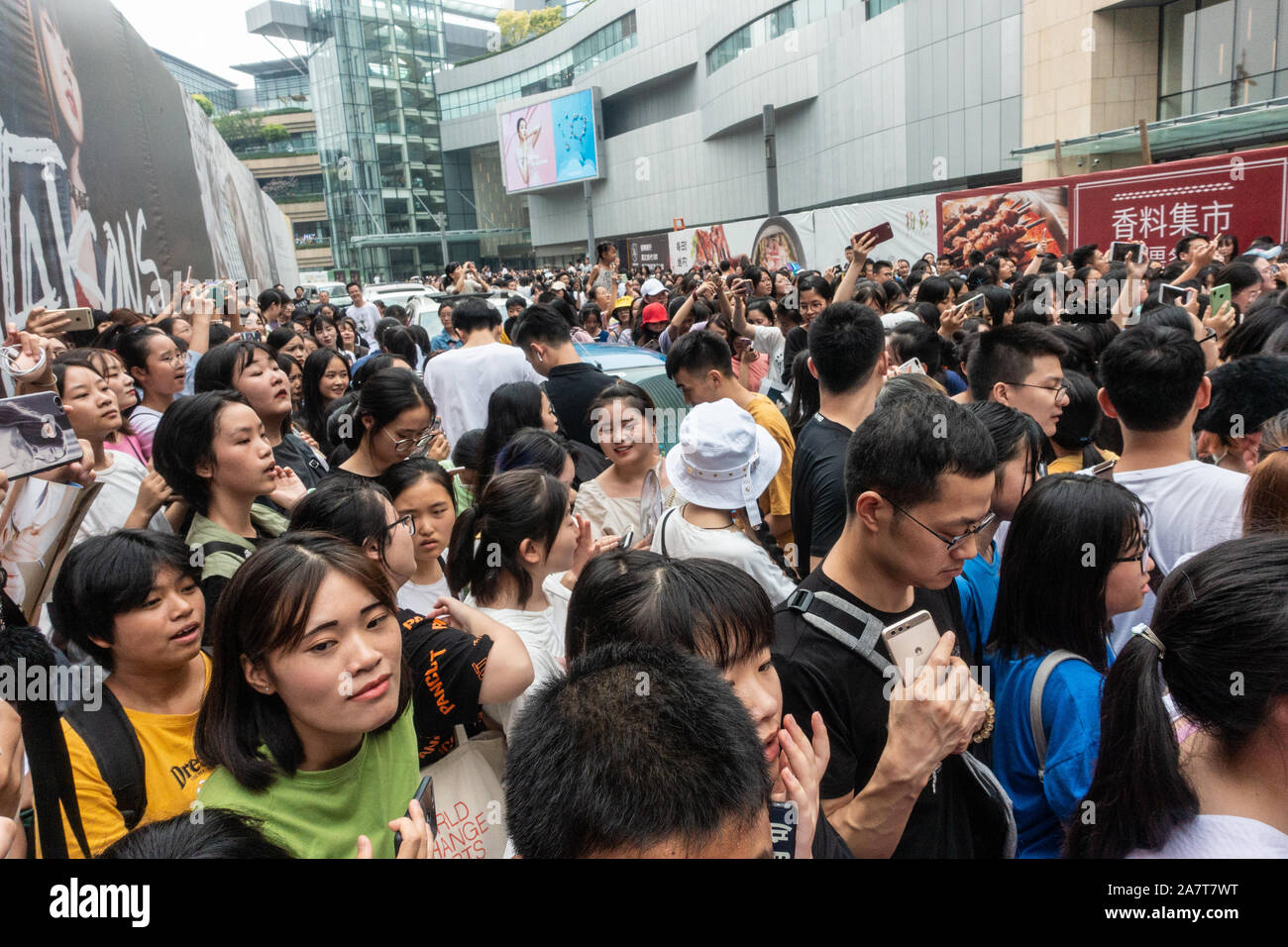 Chinese fans crowd a shopping mall to support singer and actor Karry ...