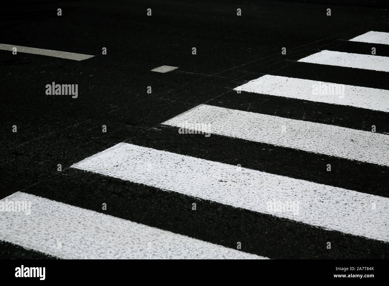 zebra crosswalk on a asphalt road background Stock Photo - Alamy