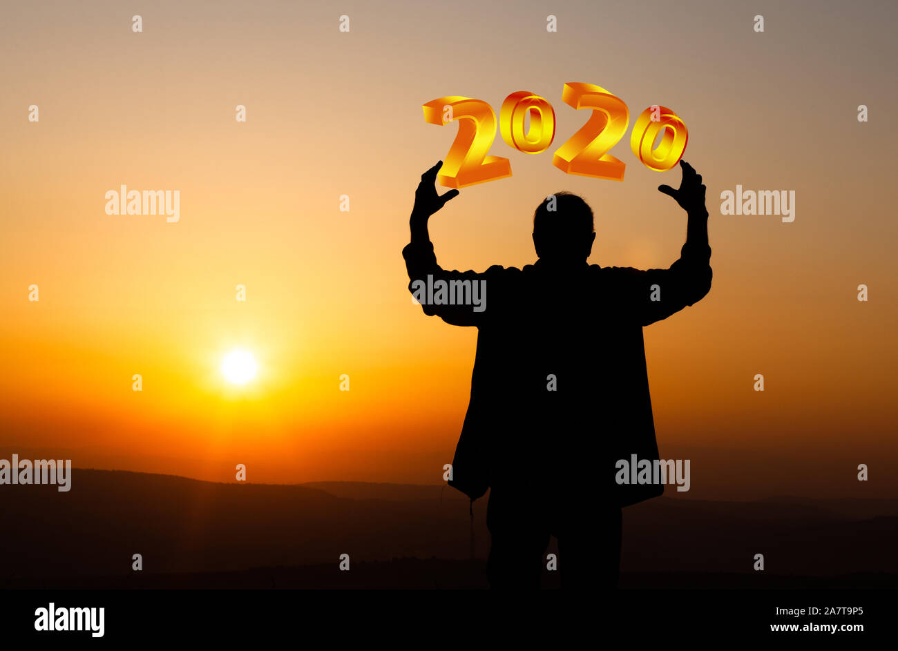 man silhouette holding 2020 in sunset Stock Photo - Alamy