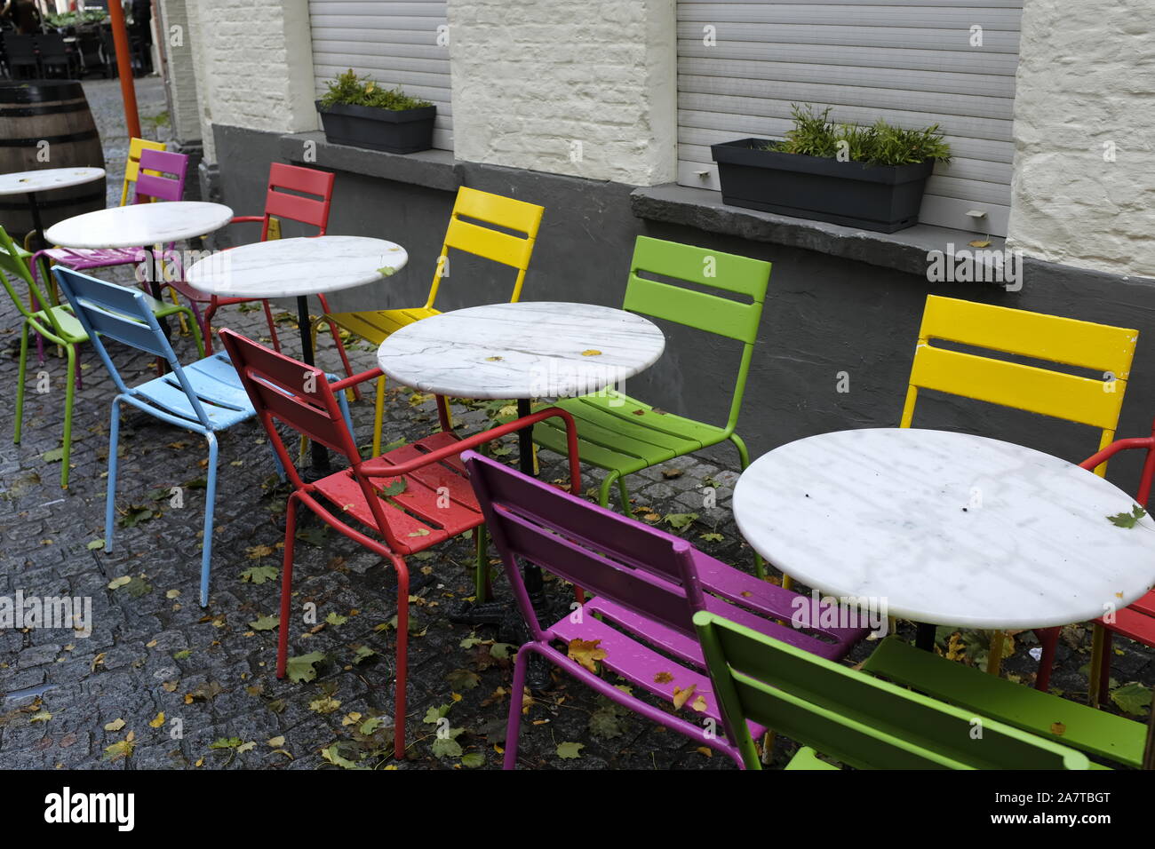 colourfull chairs outsider a café Stock Photo - Alamy