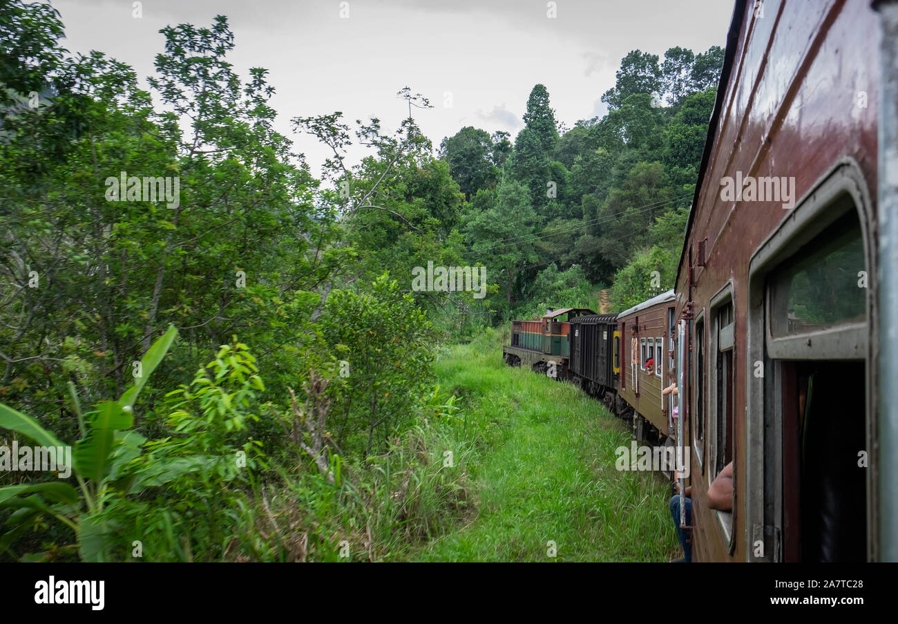 ELLA/ DEMODARA, SRI-LANKA: AUGUST 08/ 2019: The local train acrossing ...