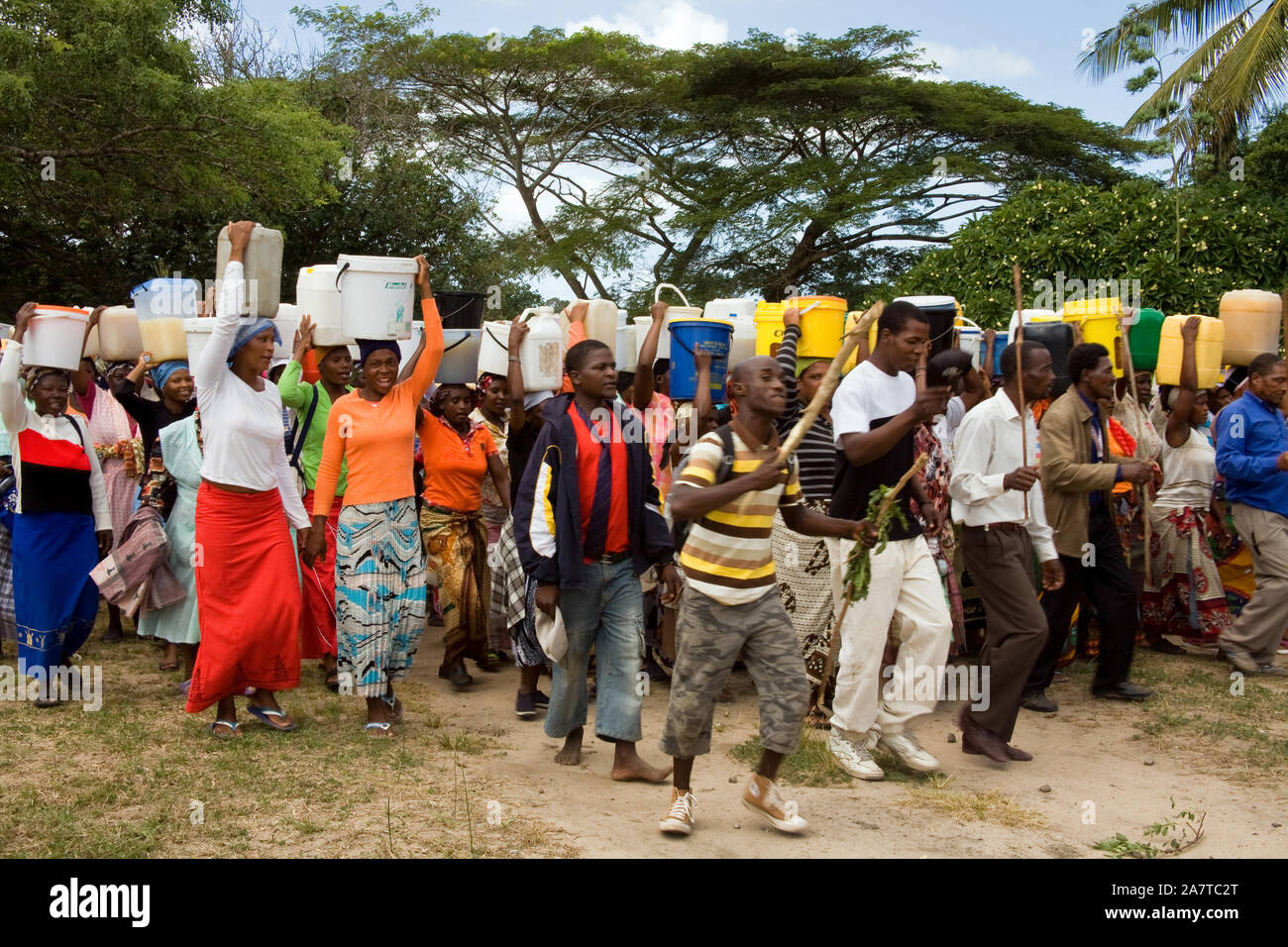 Women carrying containers with marula beer on their heads at the Tembe ...