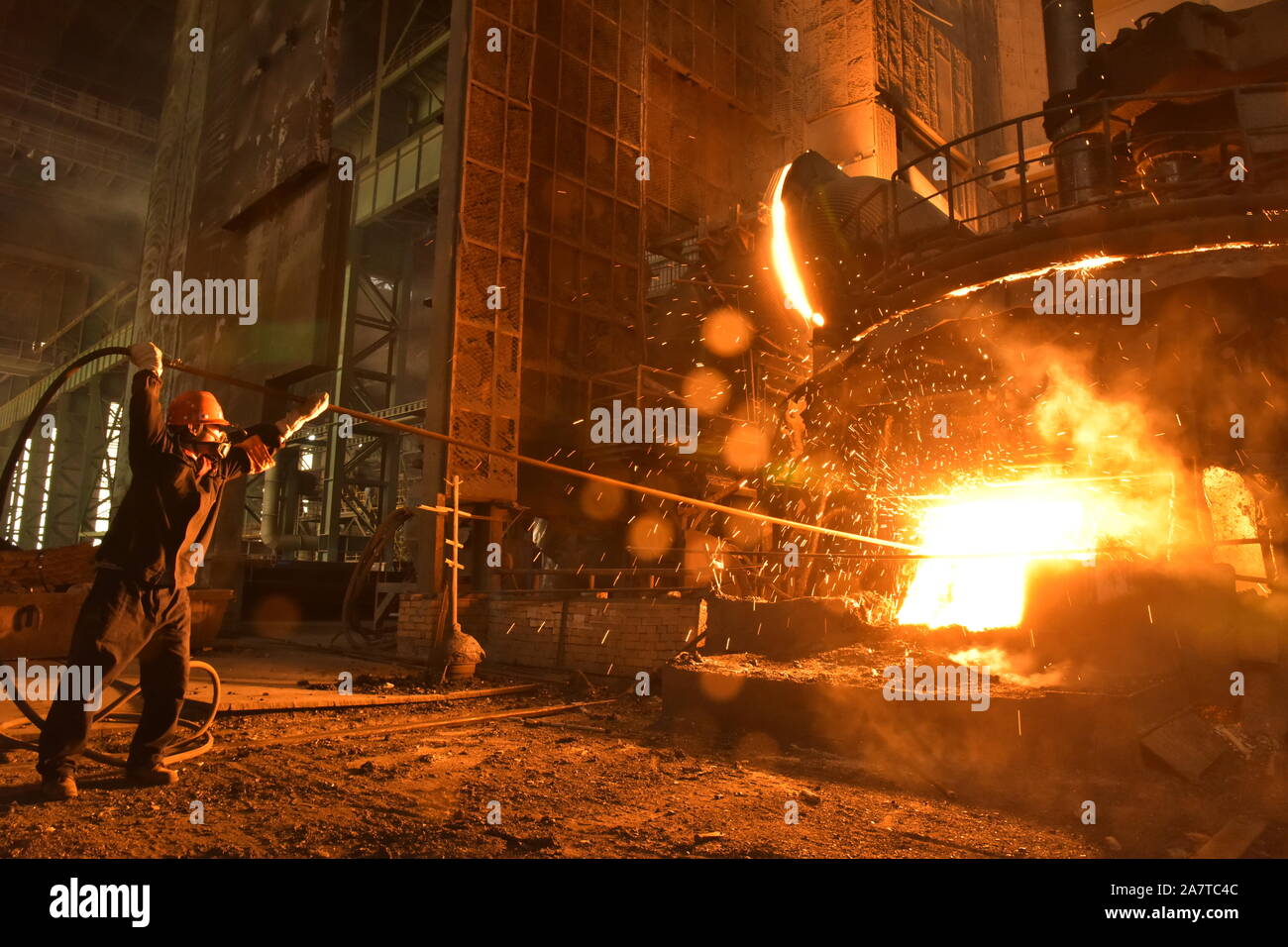 --FILE--A Chinese worker processes steel parts at the plant of Shandong ...