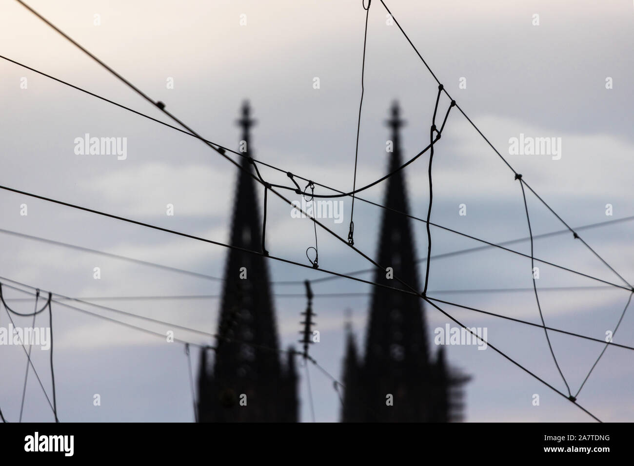 train track overhead line and dom of cologne Stock Photo - Alamy