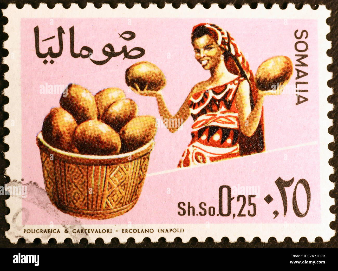 Woman and coconuts on postage stamp of Somalia Stock Photo - Alamy