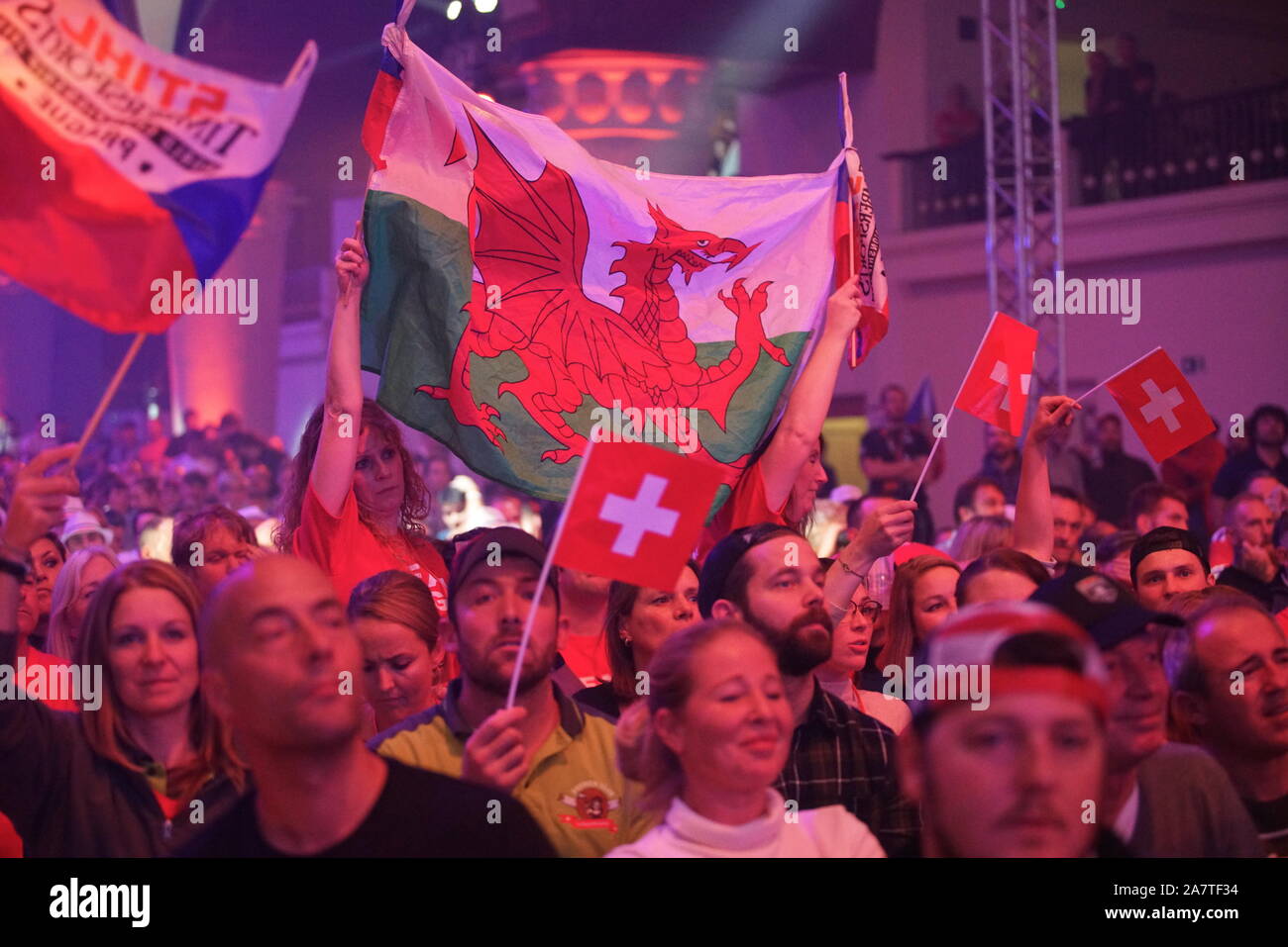 women hold the flag of the ELGAN team, supporting six-time UK champion ...