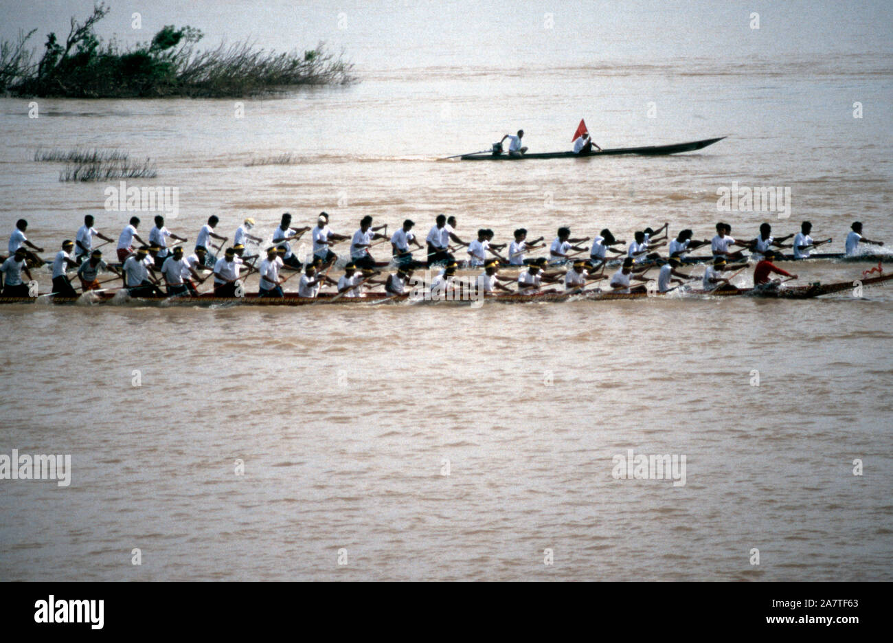 Two teams compete in a traditional Khmer boat race on the Mekong River ...