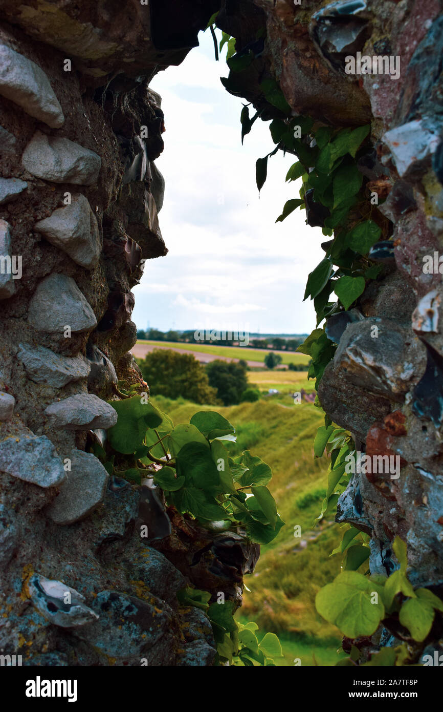 Land view through a hole in the wall Stock Photo - Alamy