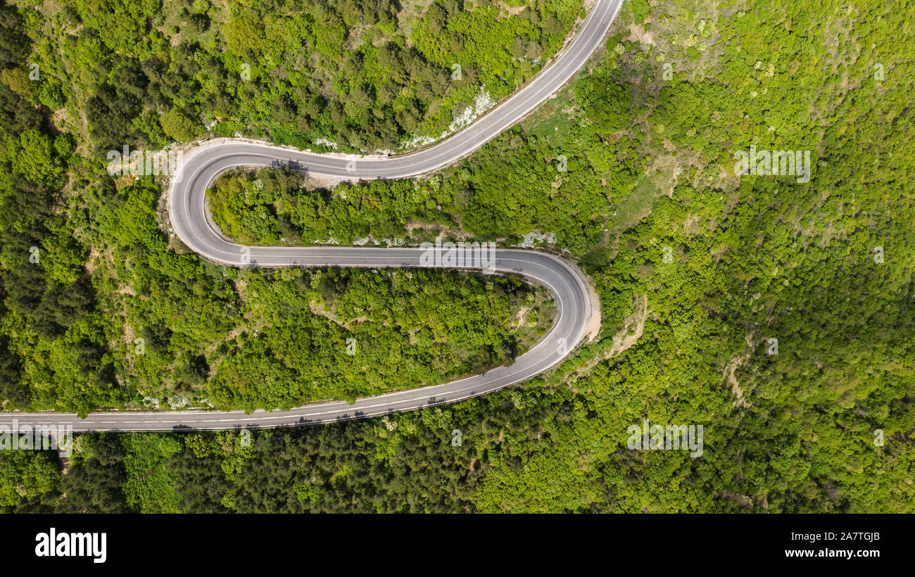 Aerial view of road through forest Stock Photo - Alamy