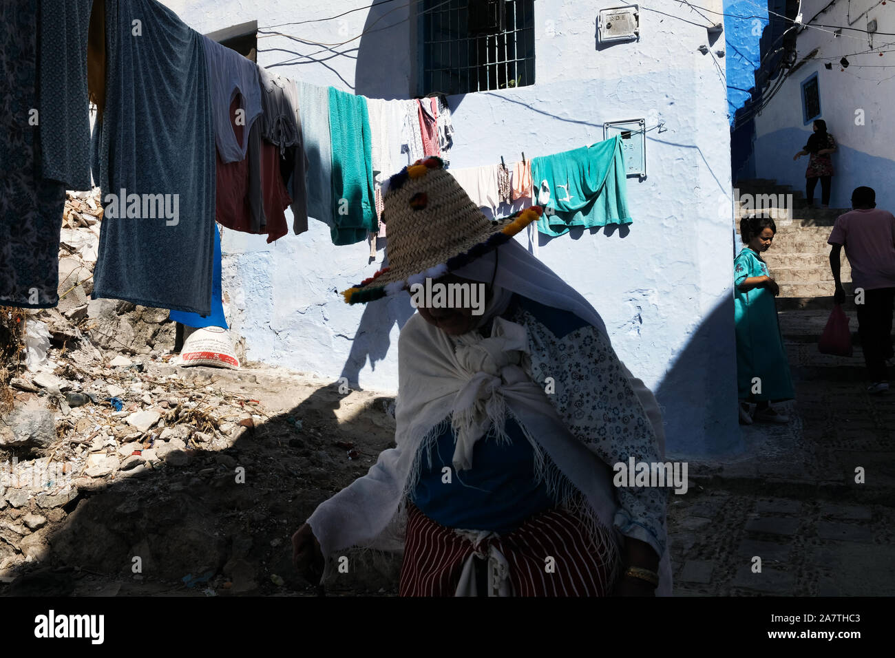 A local woman wearing traditional dress in Chefchaouen, Morrocco Stock ...