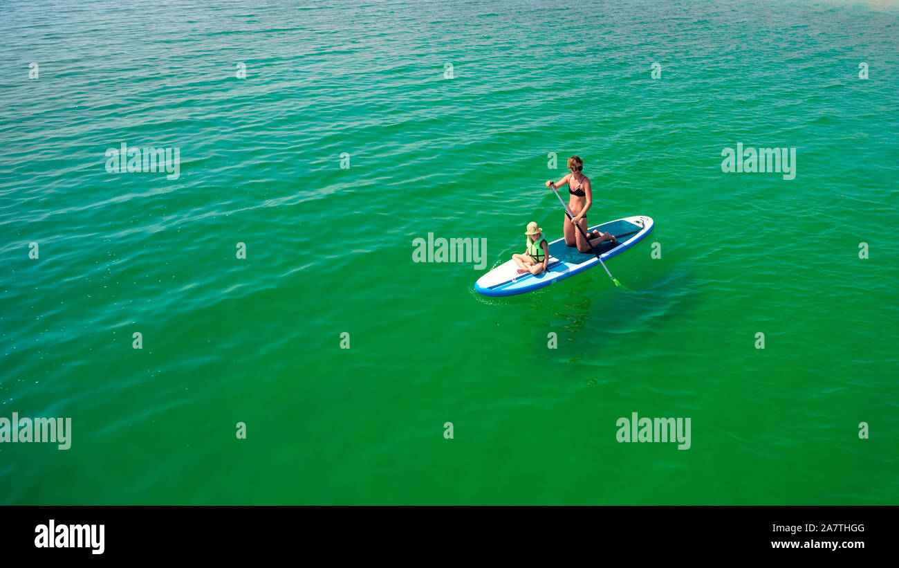 Girl paddle board parent hi-res stock photography and images - Alamy