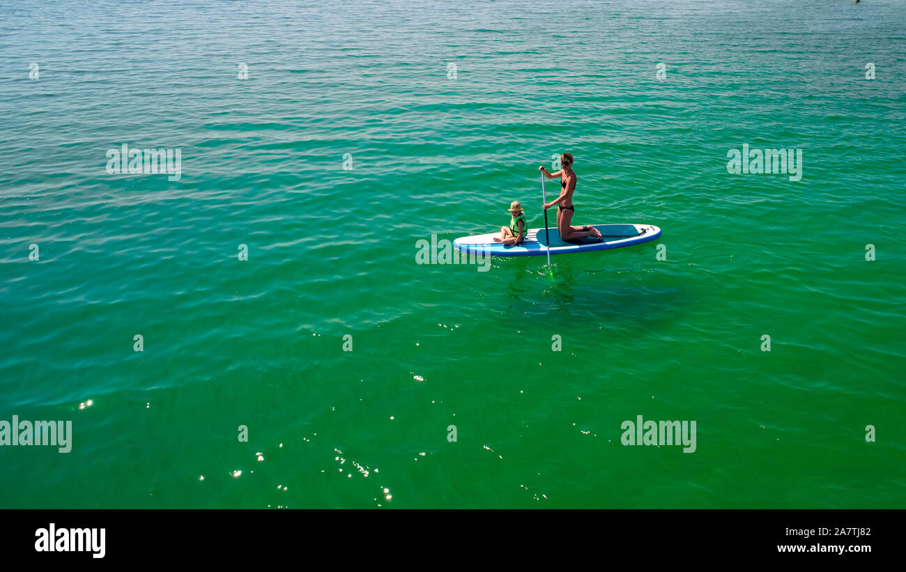 Girl paddle board parent hi-res stock photography and images - Alamy