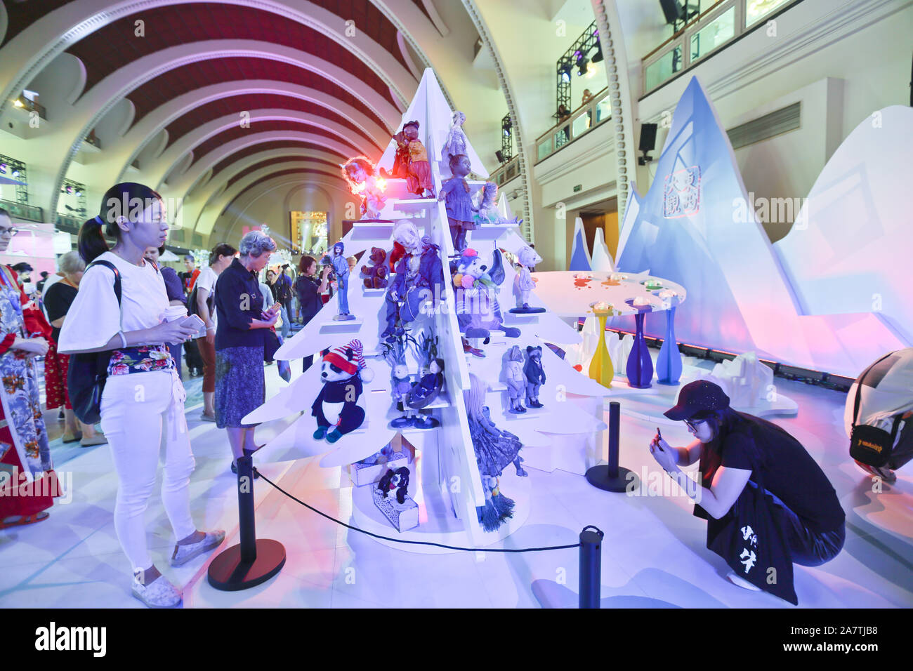 Visitors observe the designs at the Shanghai Exhibition Center in ...