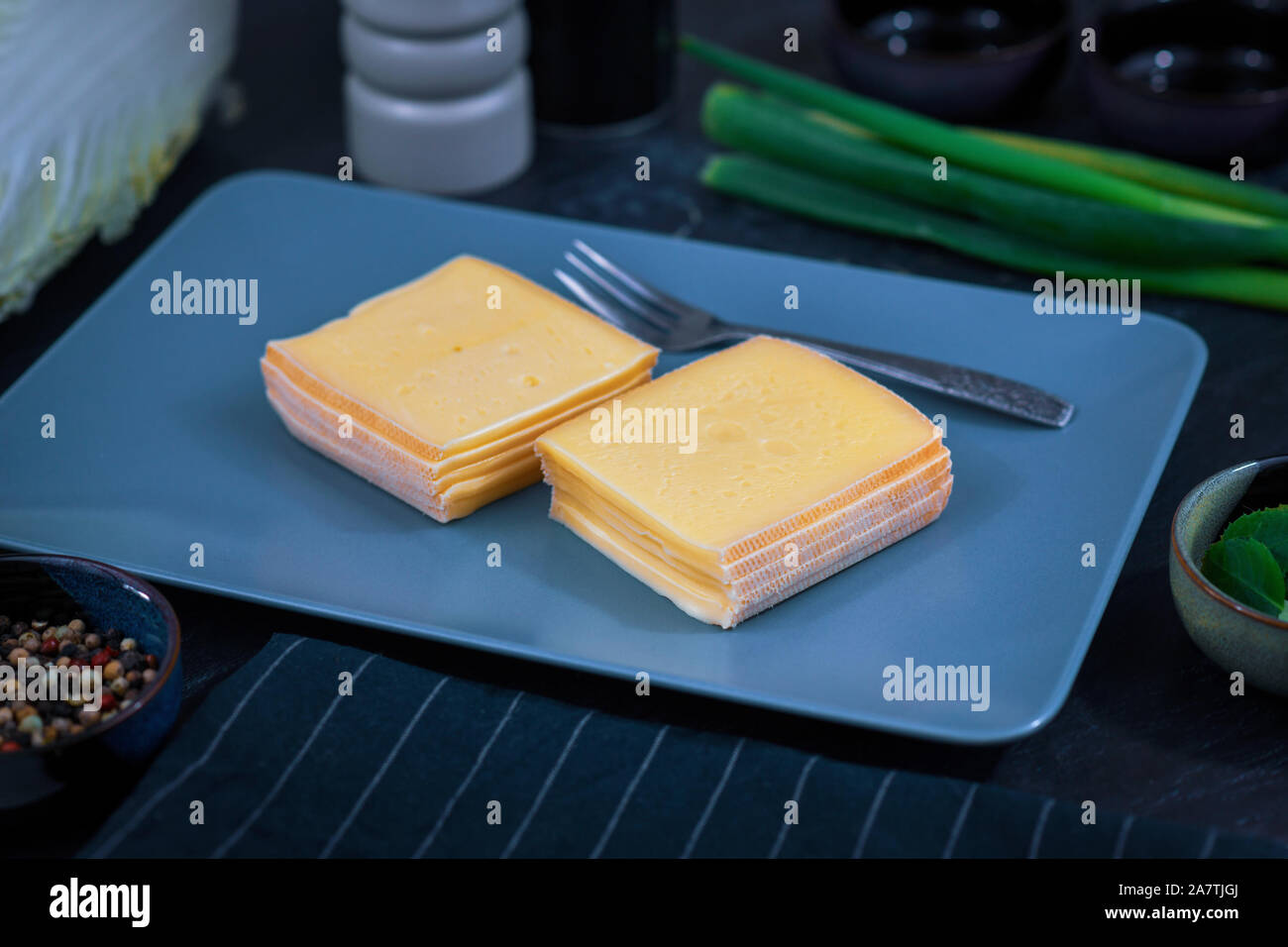 Two staples of slices of cheese called 'Raclette', commonly used for ...