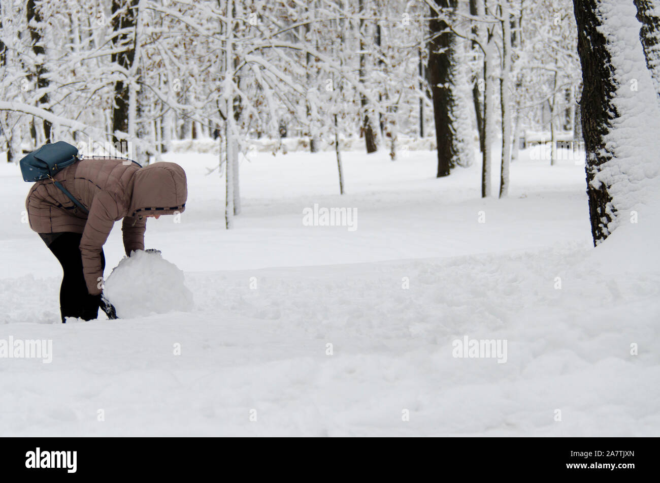 Rolls a snowball hi-res stock photography and images - Alamy