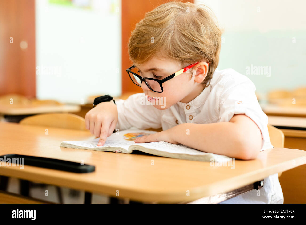 adorable blonde american primary school student with big glasses ...
