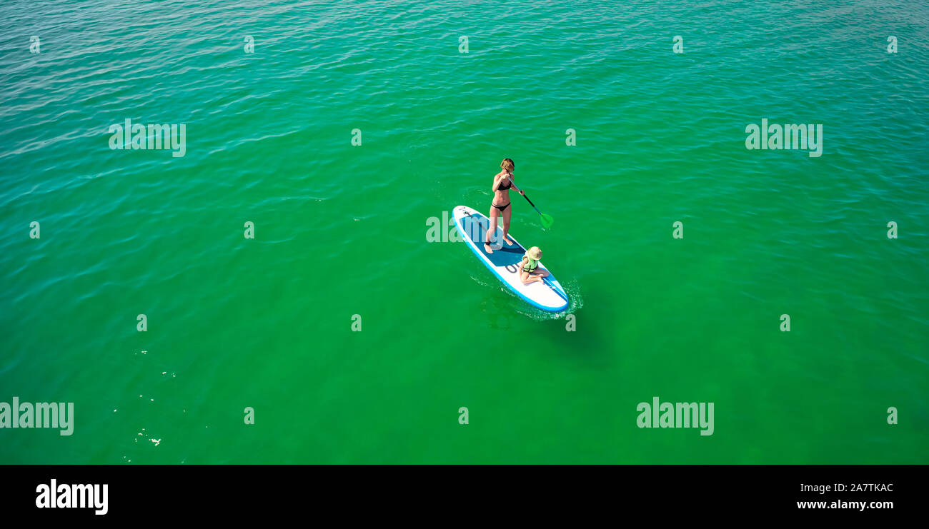 Girl paddle board parent hi-res stock photography and images - Alamy