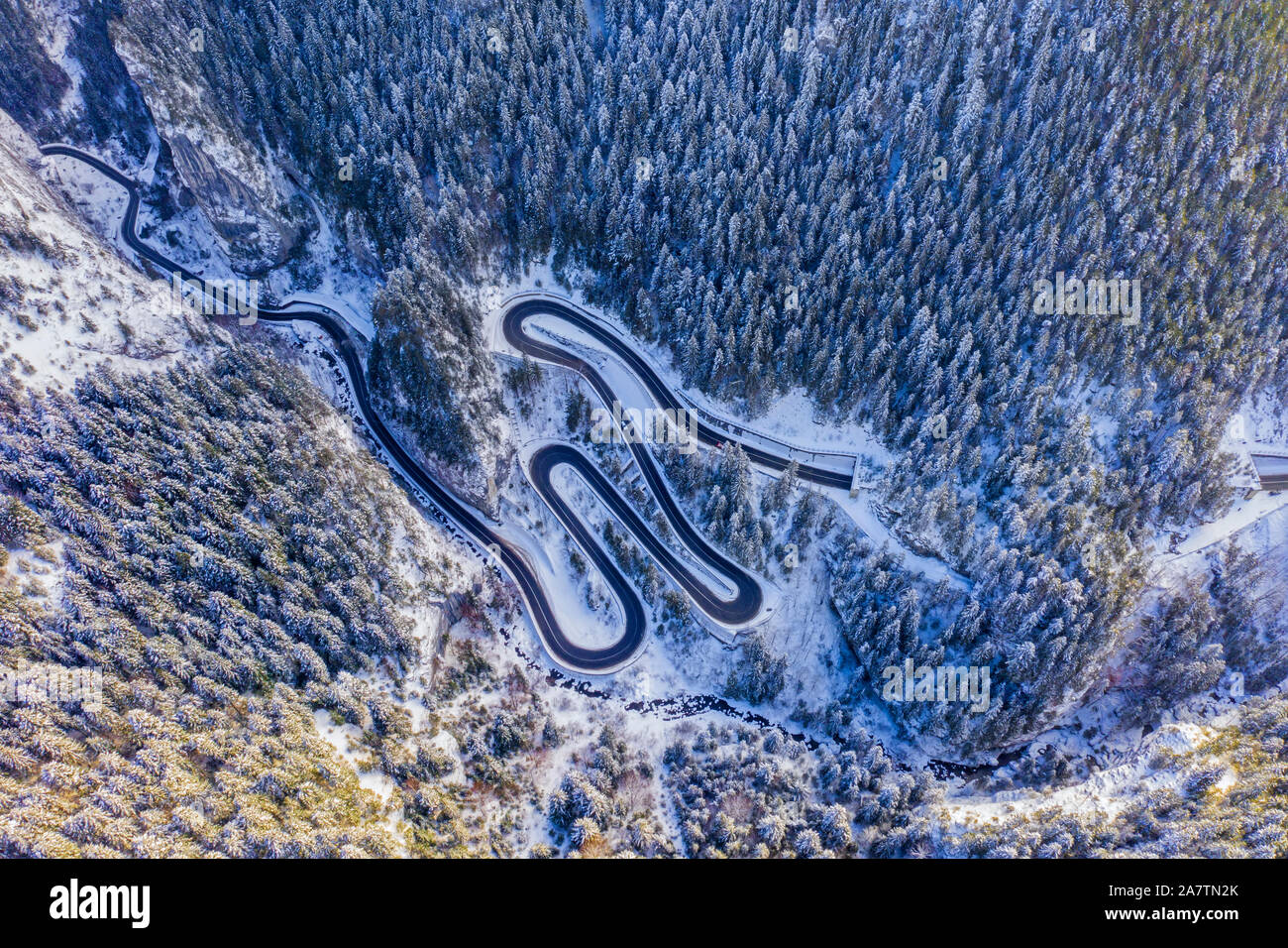 Winter serpentine in rocky mountain forest. Bicaz gorge is a narrow ...