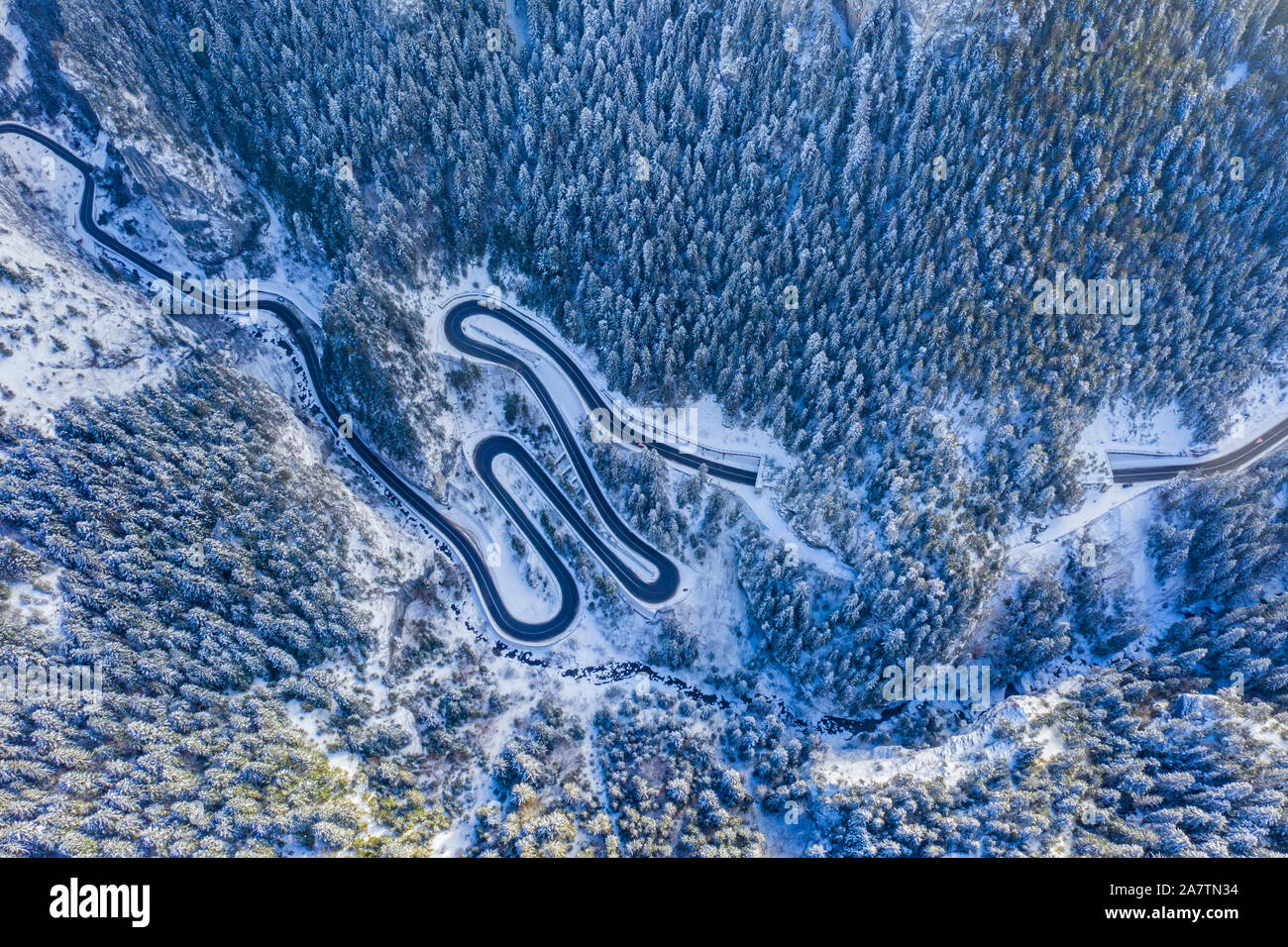 Winter serpentine in rocky mountain forest. Bicaz gorge is a narrow ...
