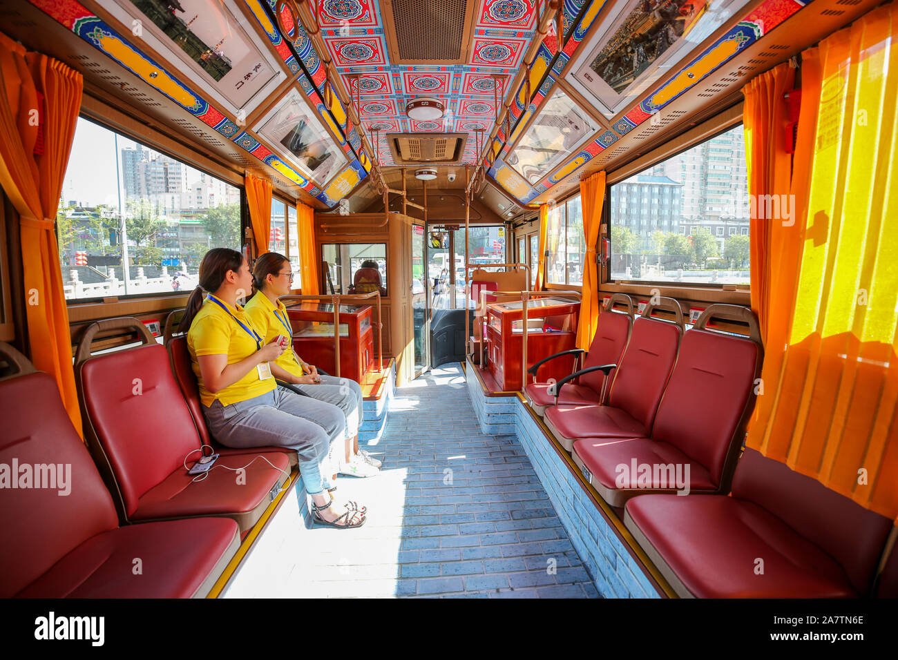 Passengers experience the old-fashioned bus in Xi’an city, northwest ...