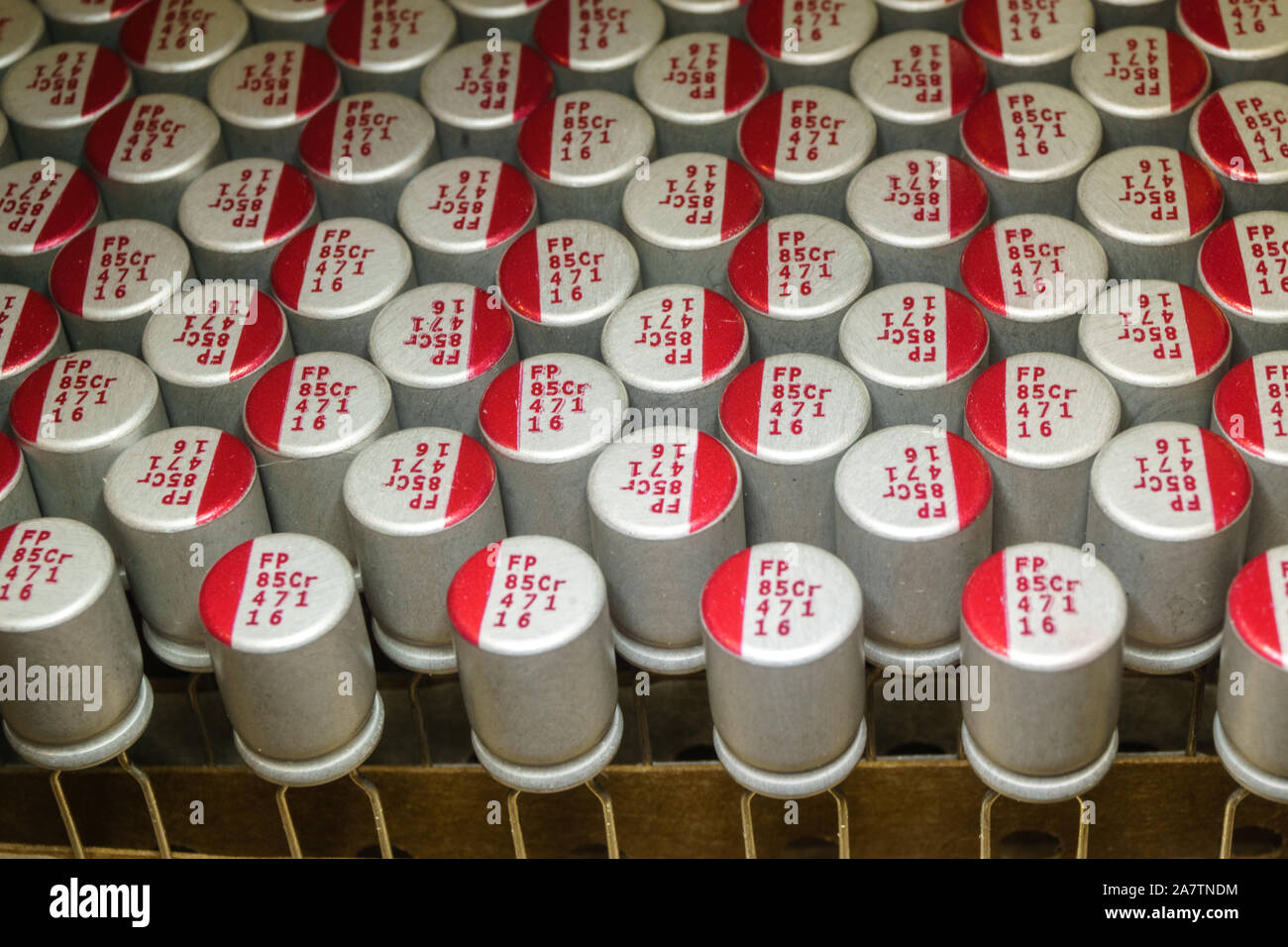 Close-up macro of close aligned polymer electrolytic capacitors ...