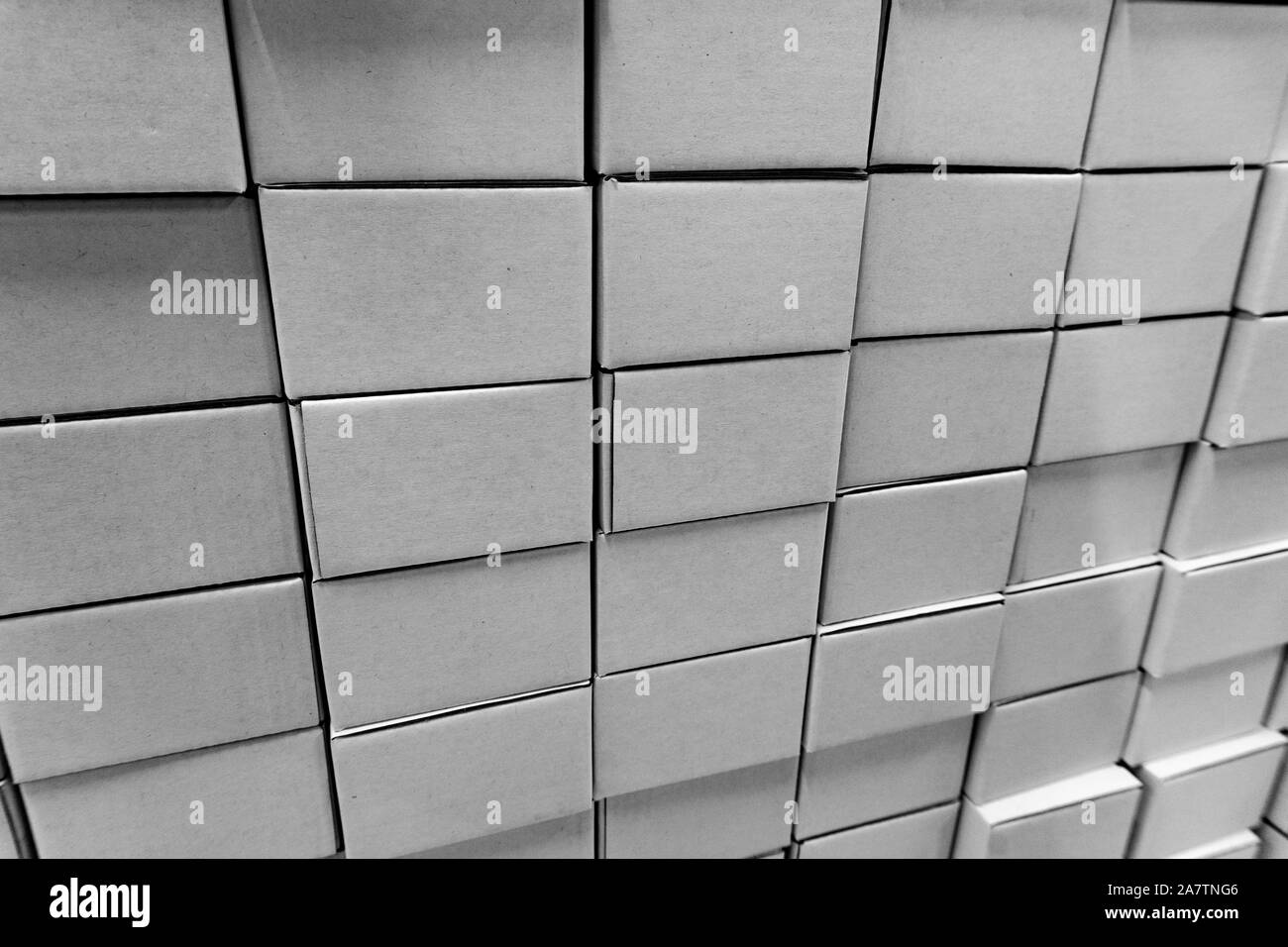 Isolated close-up of stacked wall made of multiple blank white closed ...