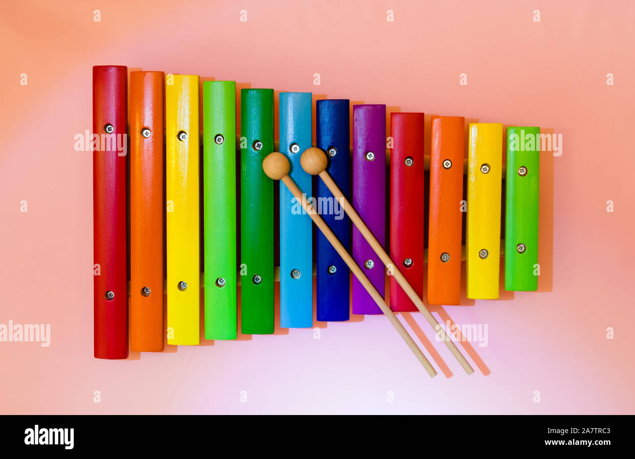 Multicolor music instrument xylophone on pink background Stock Photo ...