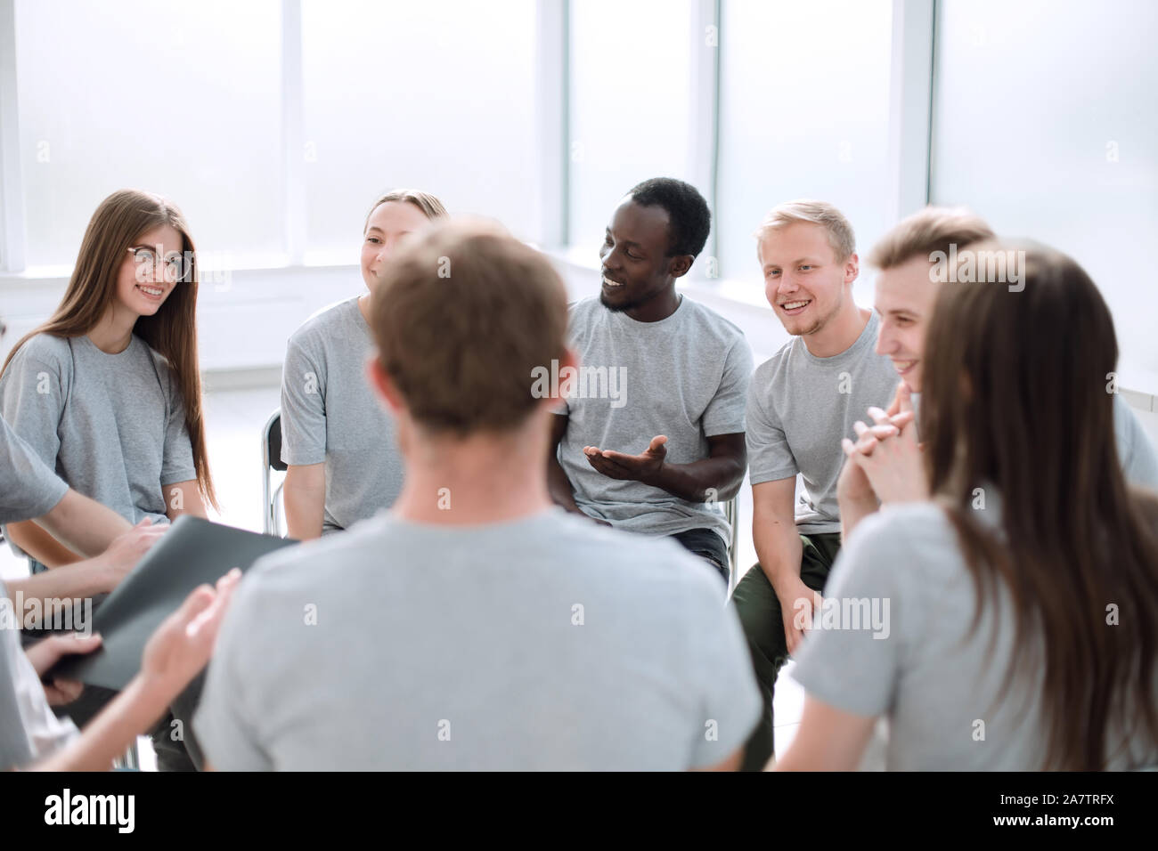 young people are discussing something sitting in a circle Stock Photo ...