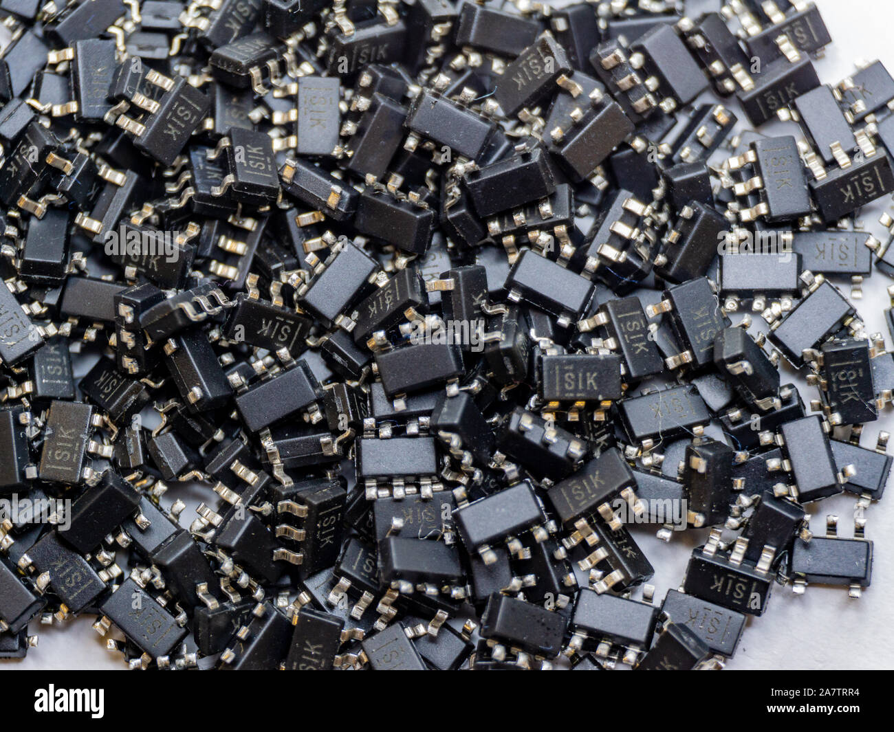 Abstract close-up of black scattered SOT-23-5 package surface mount ...