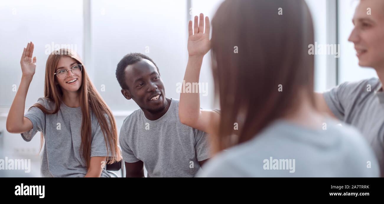 young people ask questions during the meeting Stock Photo - Alamy